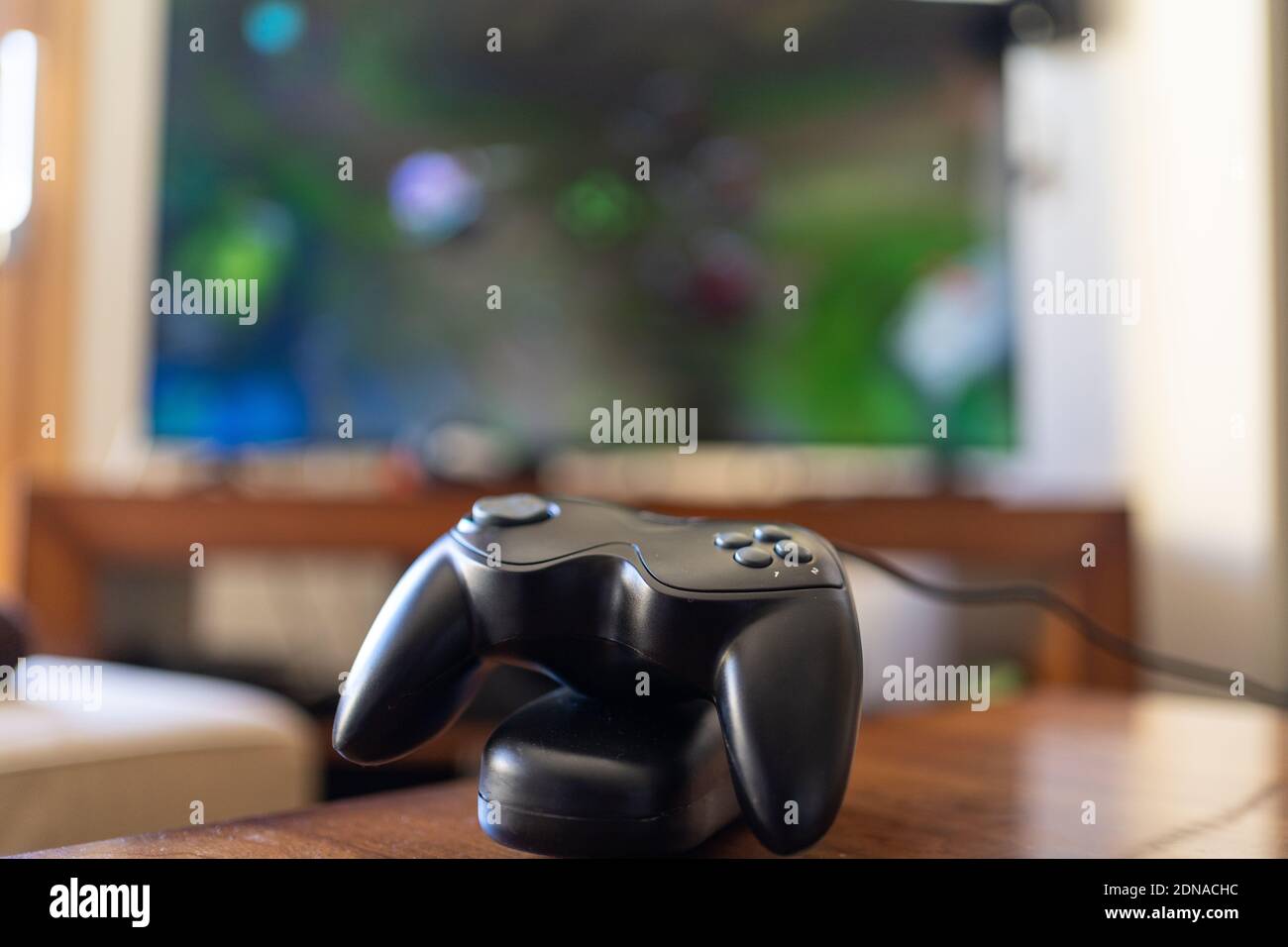 Hands with controller on it playing video games on TV Stock Photo - Alamy