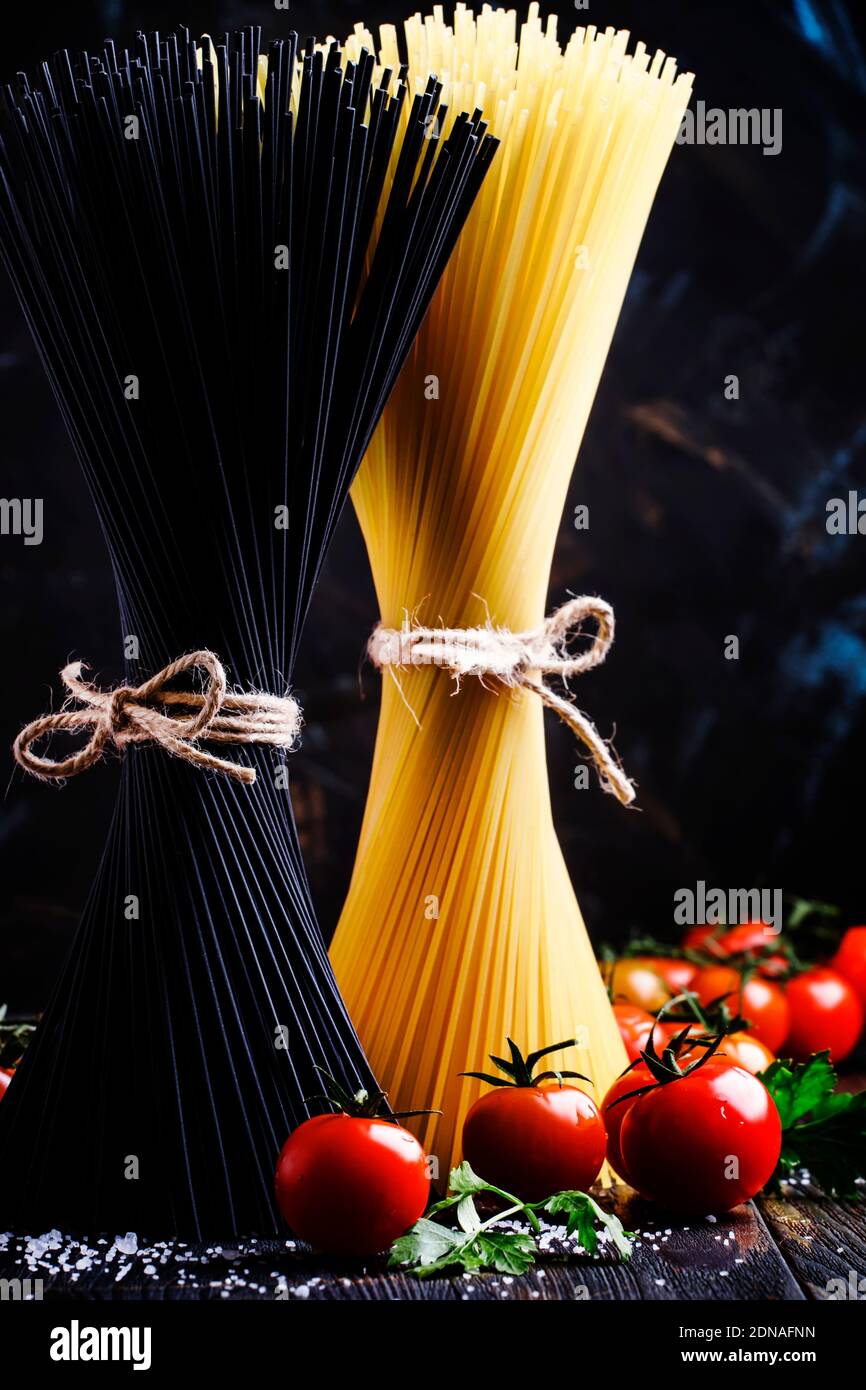 Spaghetti and tomatoes, still life in low key, selective focus Stock ...