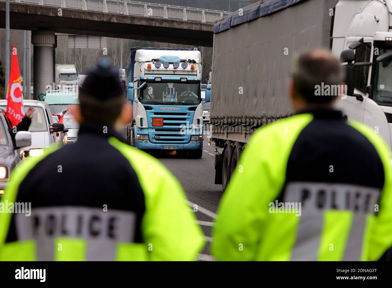 Truck drivers carry out a go-slow operation early on January 22, 2015 ...