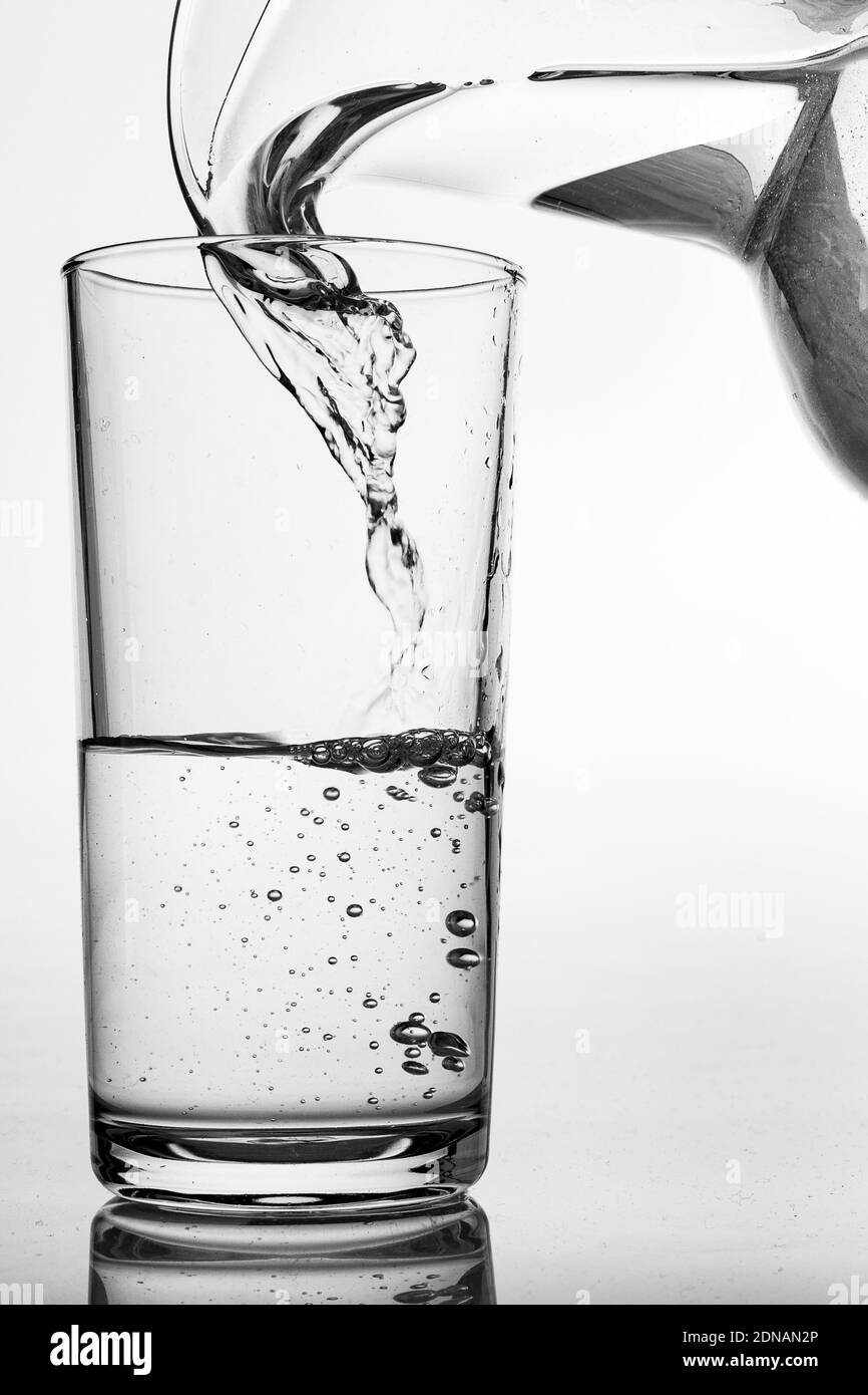 Pouring water from a glass jar hi-res stock photography and images - Alamy