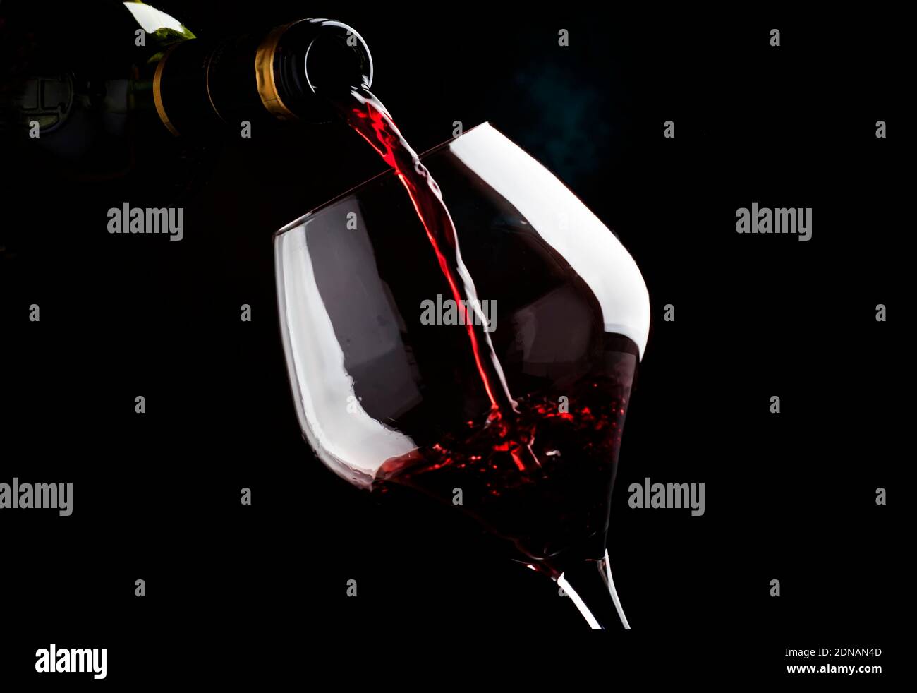 Red wine from grapes of pinot noir varieties poured into large wine ...