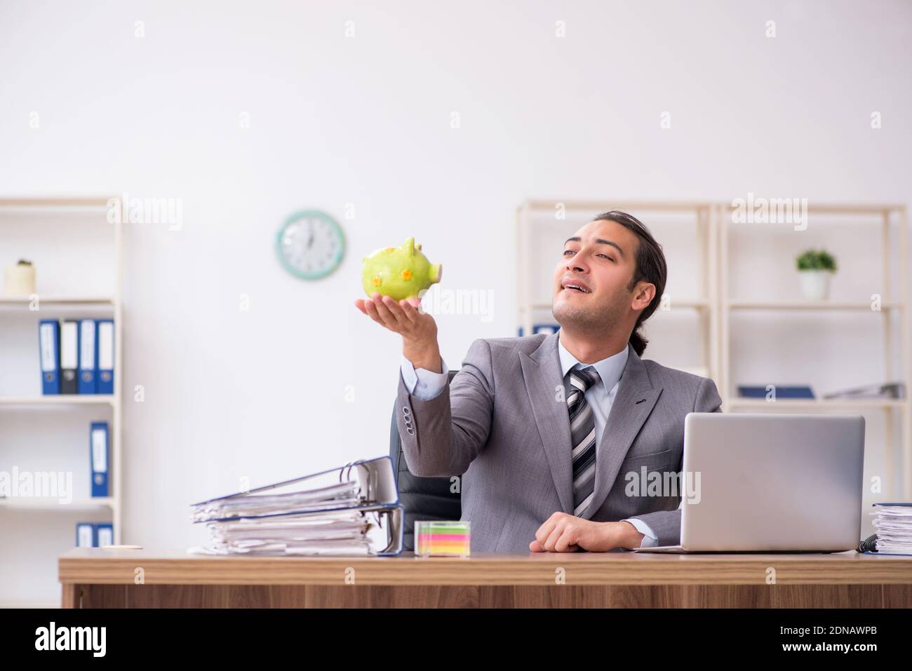 Young employee in pension concept at workplace Stock Photo - Alamy