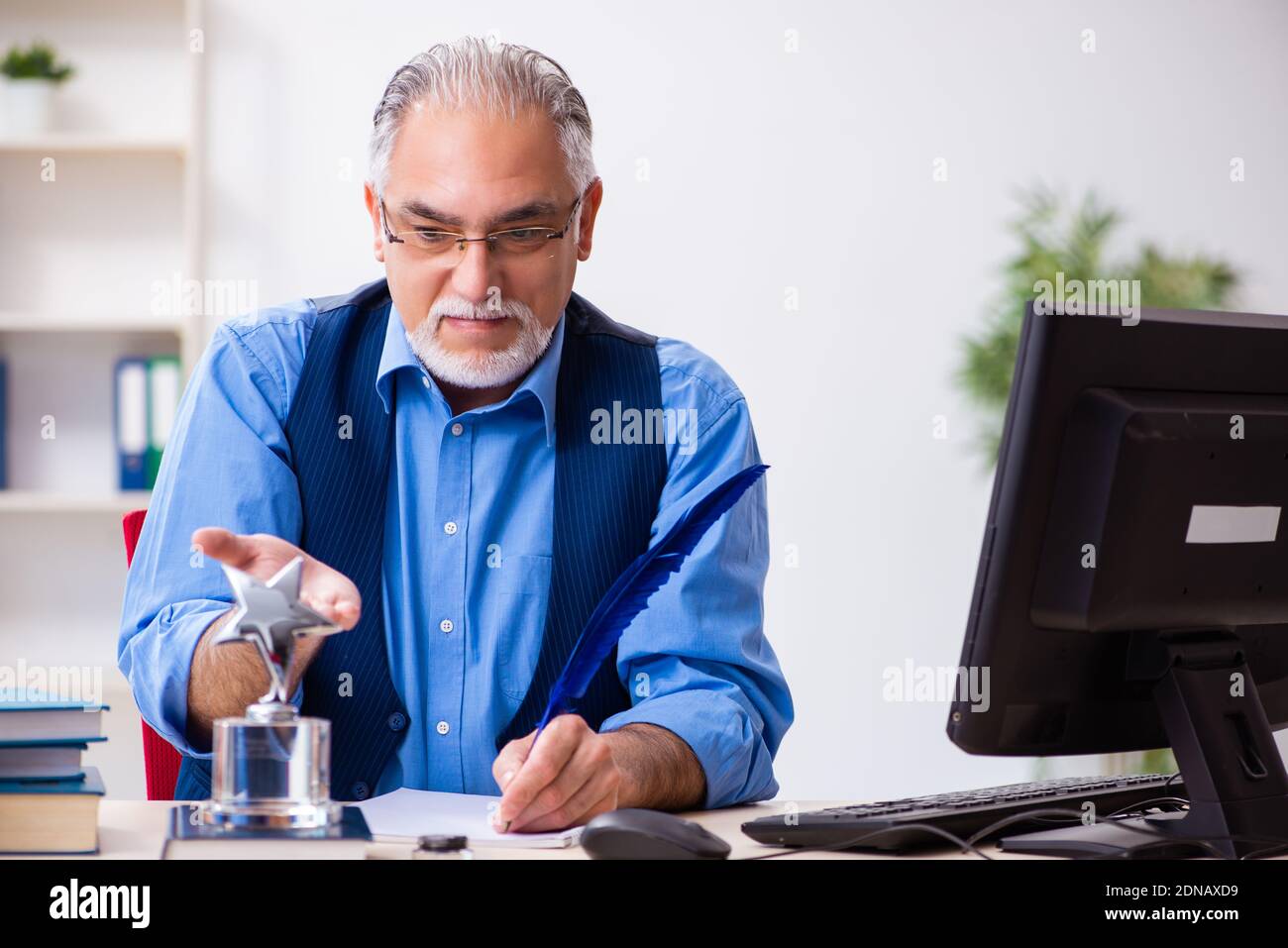 Old male author winning the award Stock Photo - Alamy