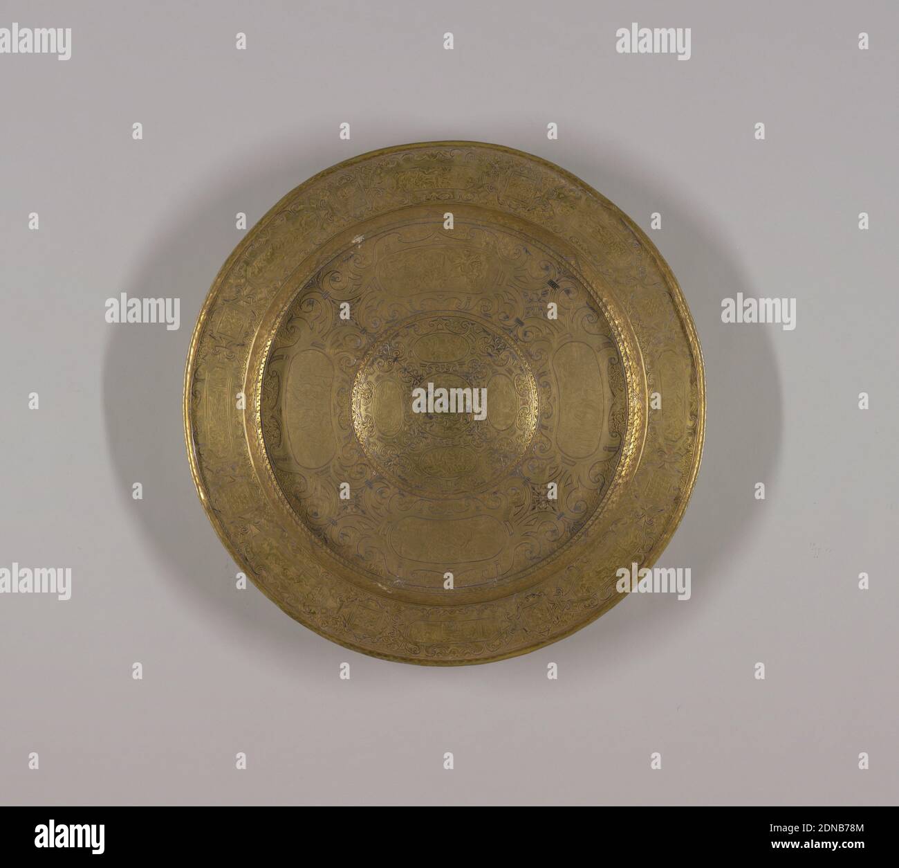 Dish, Engraved brass inlaid with silver, A wide rim with turned-over ...