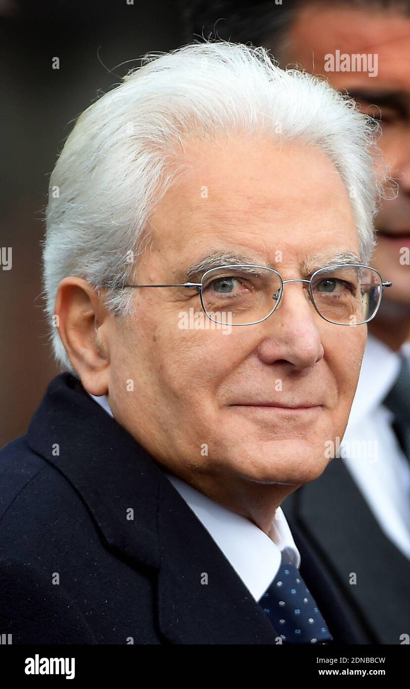 Newly elected President, Sergio Mattarella stands after laying a wreath ...