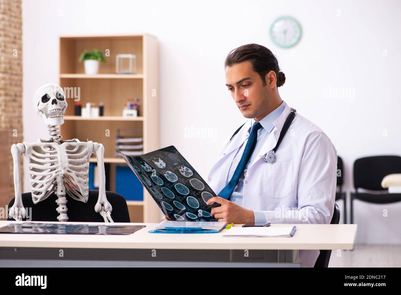 Young doctor radiologist and skeleton patient in the clinic Stock Photo ...