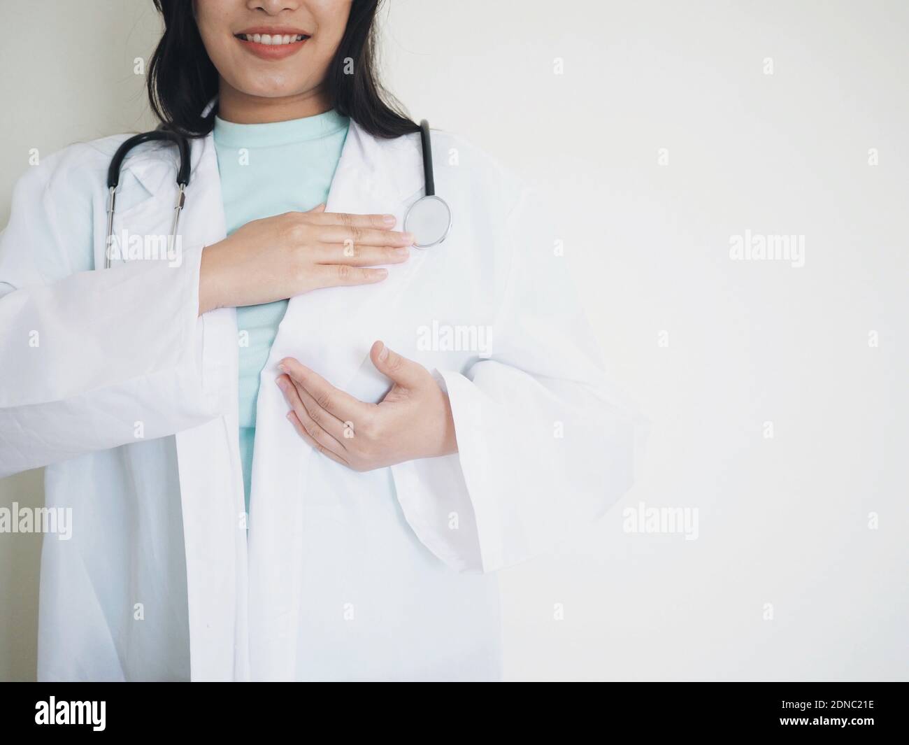 Midsection Of Female Doctor Standing Against White Background Stock ...