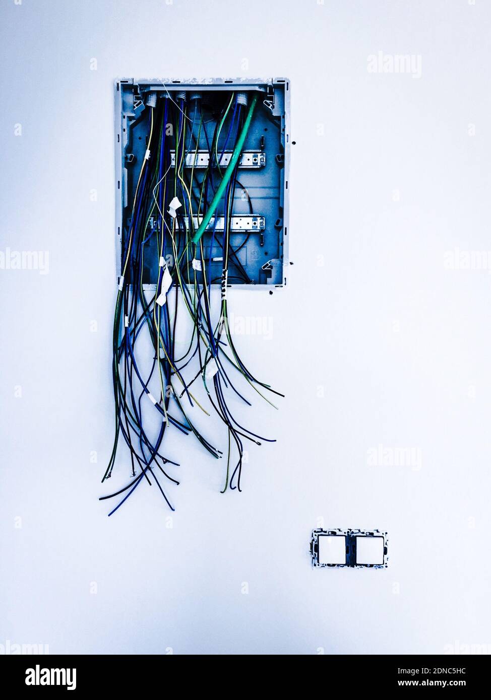 Electrical wires hanging wall hi-res stock photography and images - Alamy
