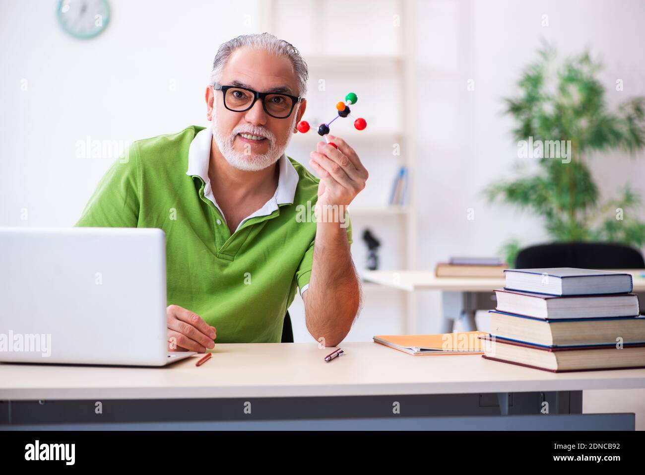 Senior male student physicist studying molecular model Stock Photo - Alamy