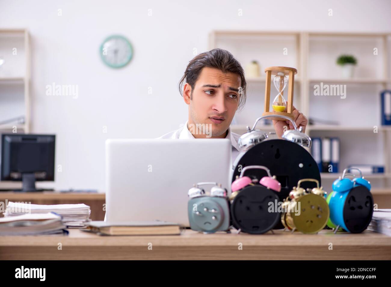 Young employee afraid of missing deadline at workplace Stock Photo - Alamy