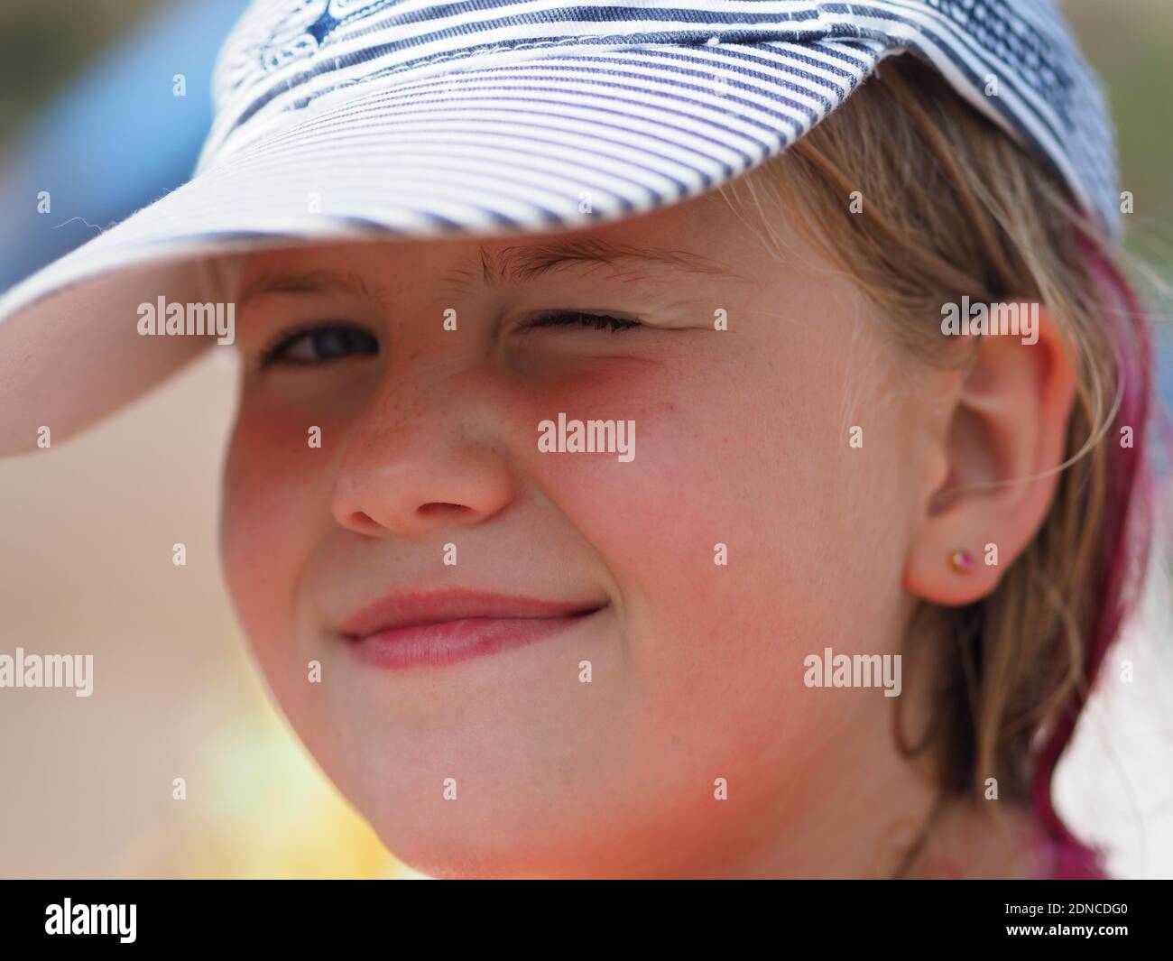 Girl winking close up hi-res stock photography and images - Alamy