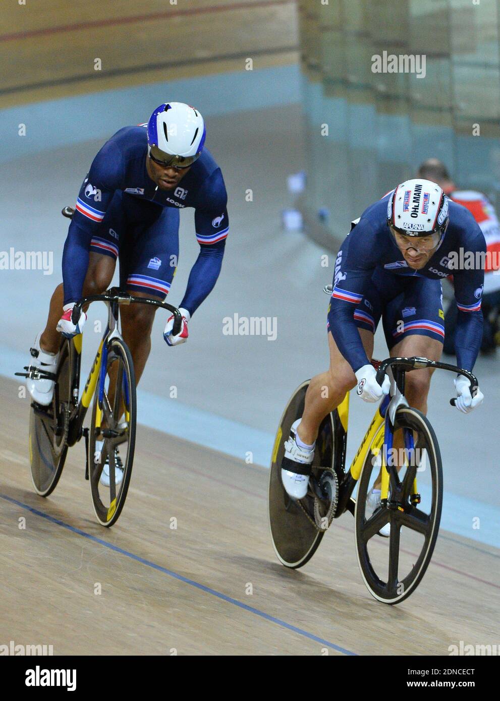 France's Gregory Bauge reacts after crossing the finish line ahead of ...