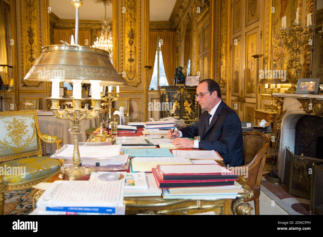French president Francois Hollande sits at his desk in his office at ...