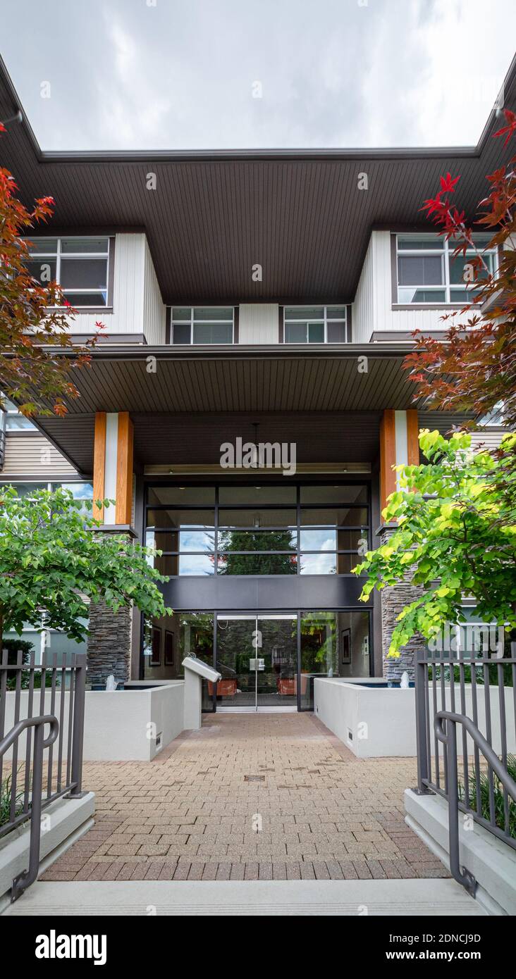 Entrance of new residential building with paved area in front Stock ...