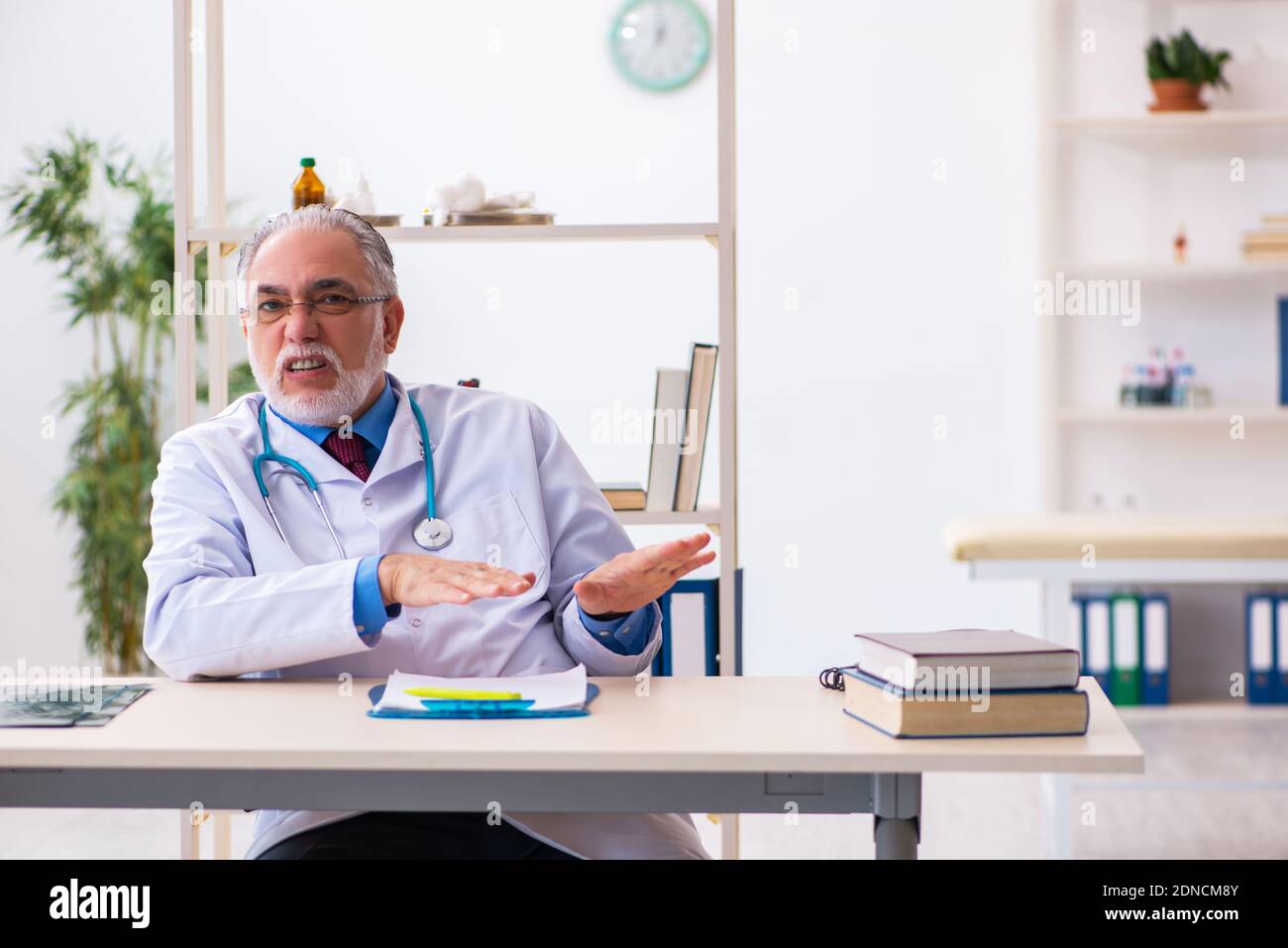 Senior male doctor tired after night shift Stock Photo - Alamy