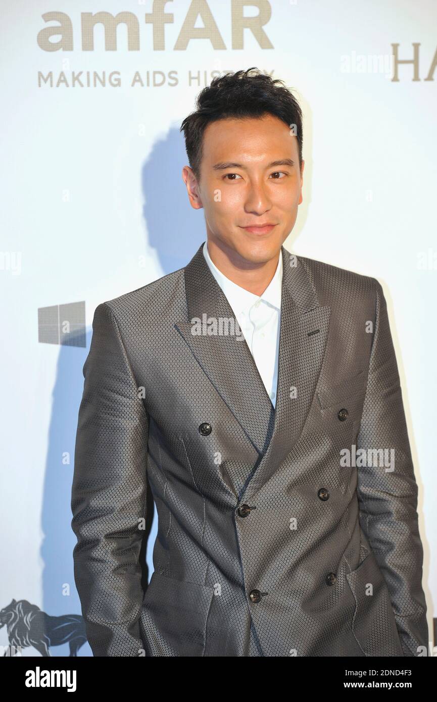 Actor Sunny Wang arrives on the red carpet during the 2015 amfAR Hong ...