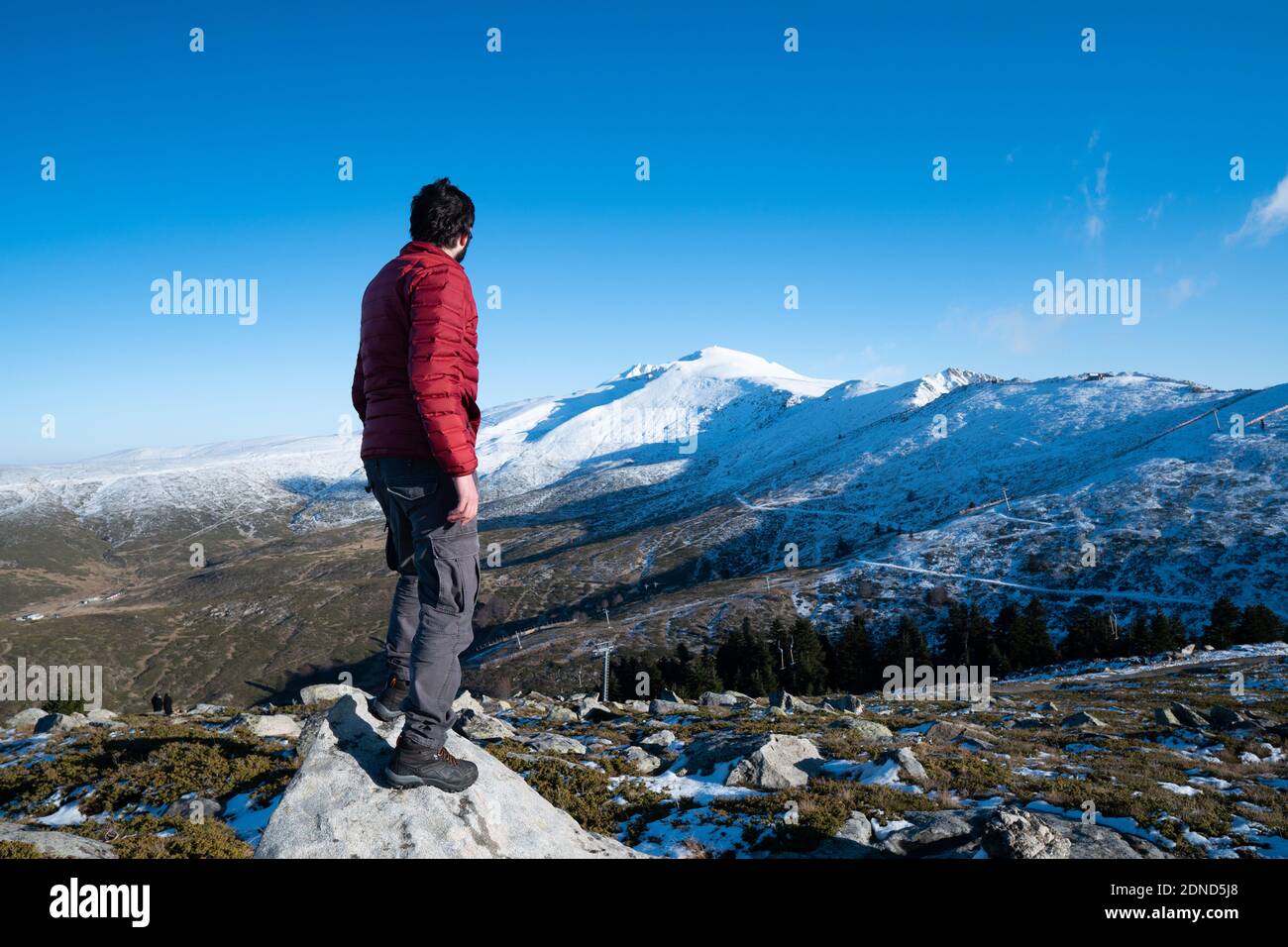 Man standing peak snowy mountain hi-res stock photography and images ...