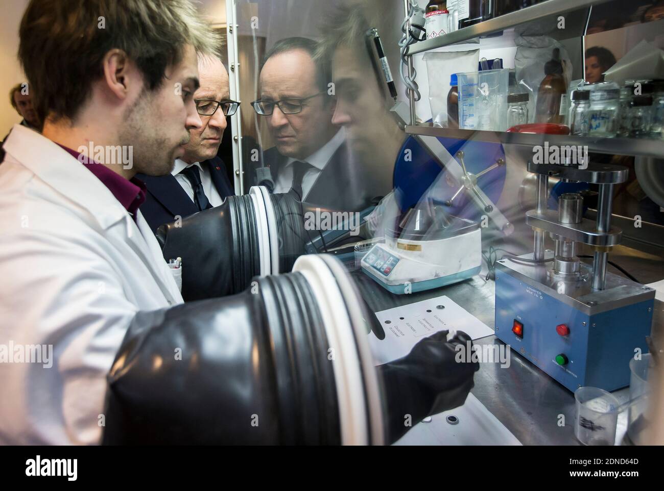 French president Francois Hollande is shown equipment by a laboratory ...