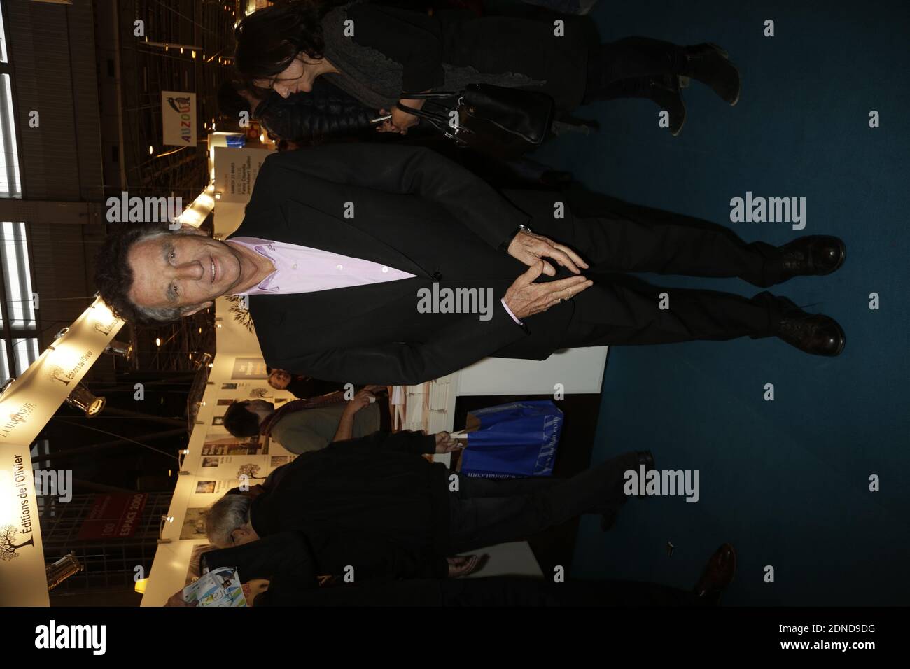 Jack Lang signs copies of his book during the 35th Salon du Livre de ...