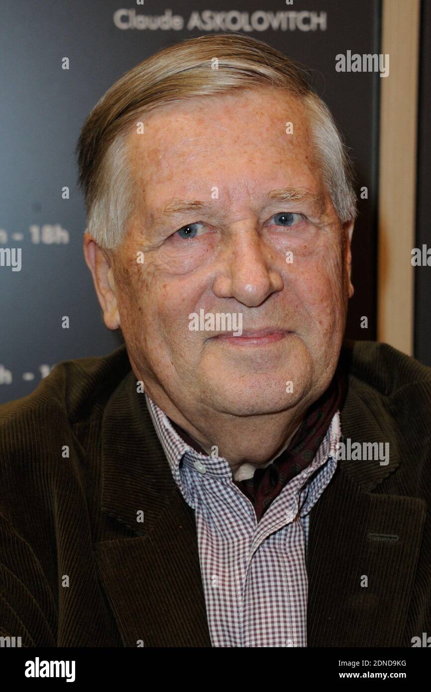 Patrice Duhamel signs copies of his book during the 35th Salon du Livre ...