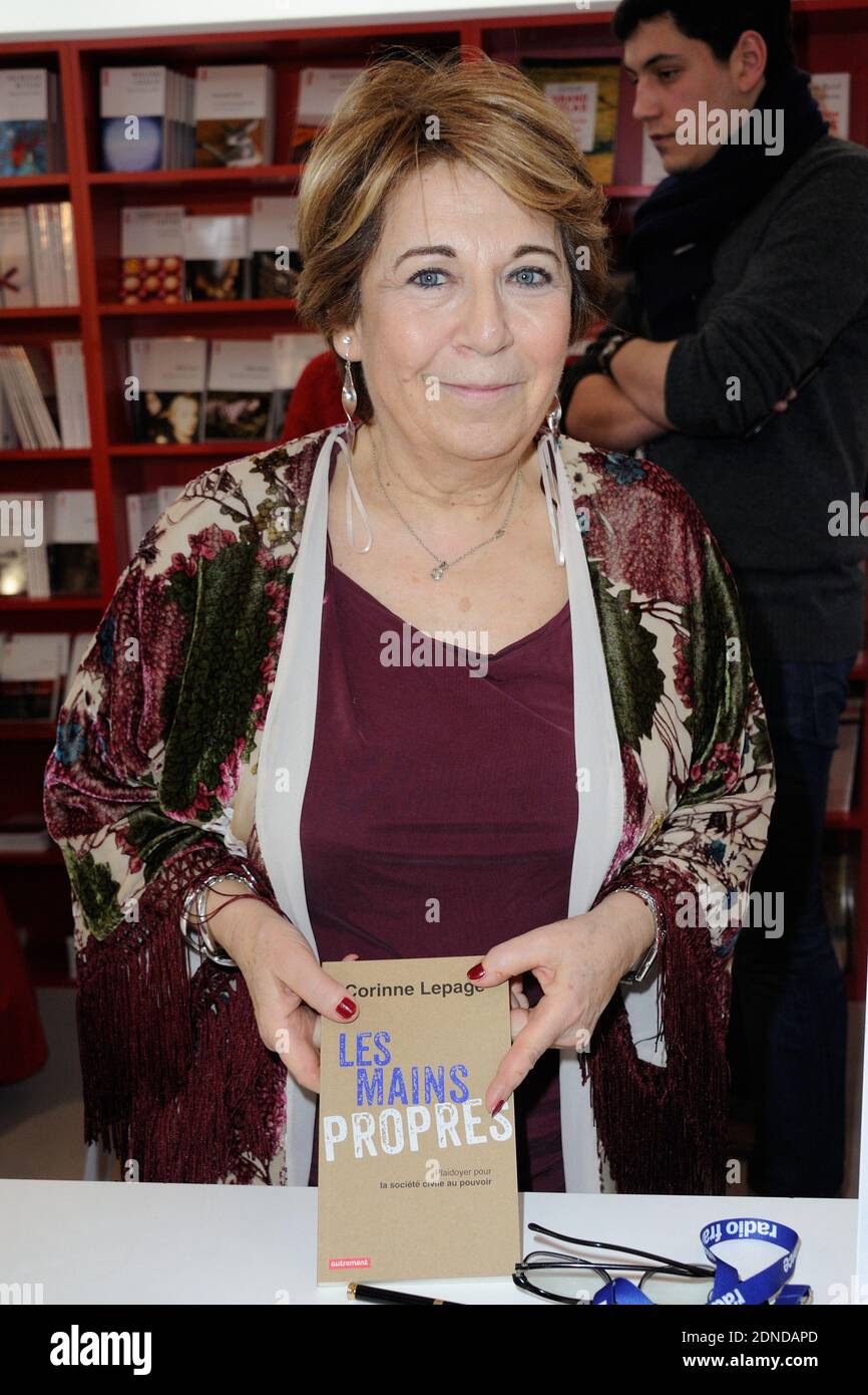 Corinne Lepage signs copies of her book during the 35th Salon du Livre ...