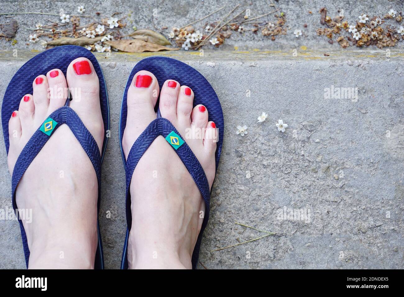 Woman wearing flip flops hi-res stock photography and images - Alamy