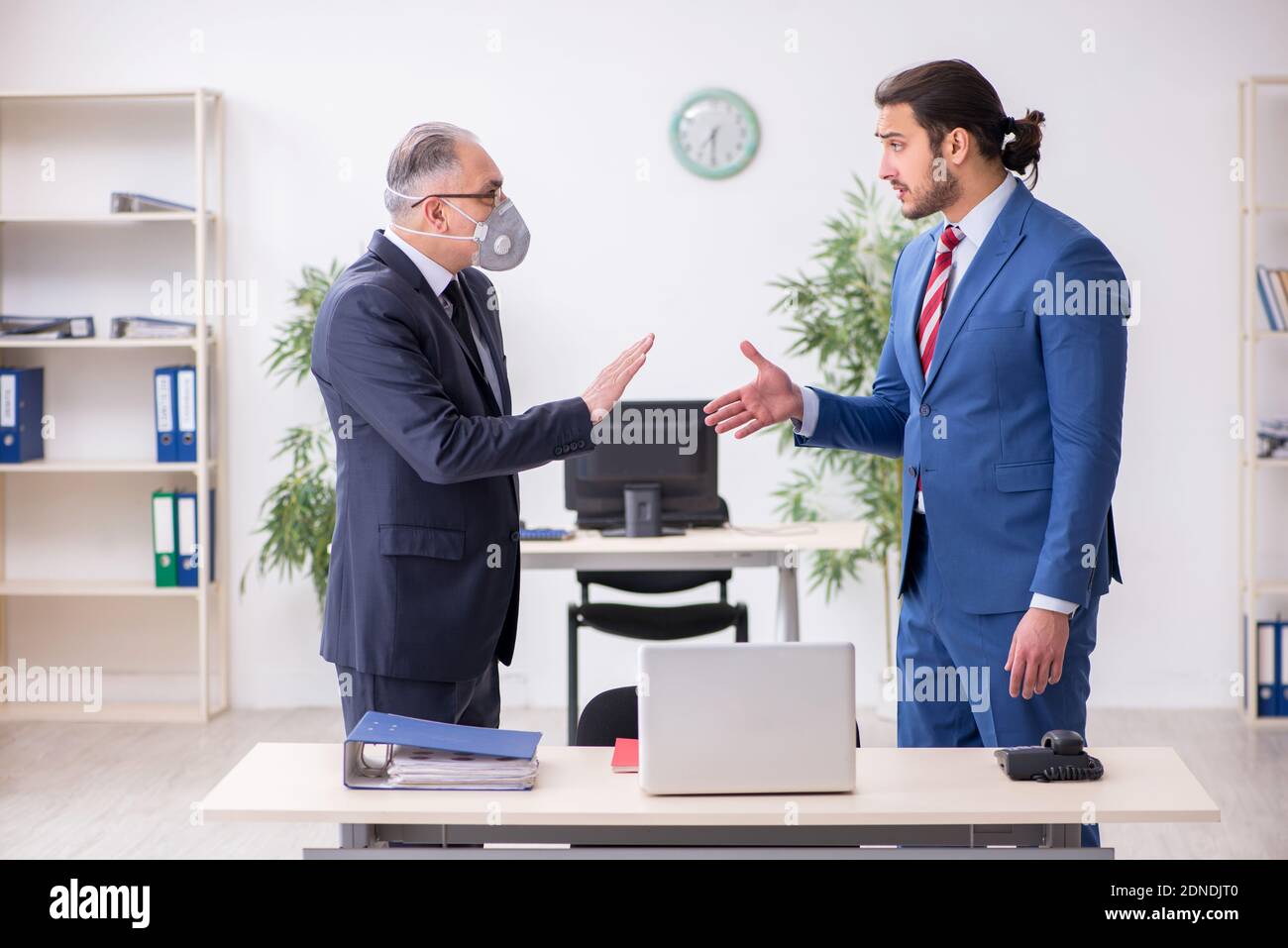 Employees at workplace during pandemic Stock Photo - Alamy