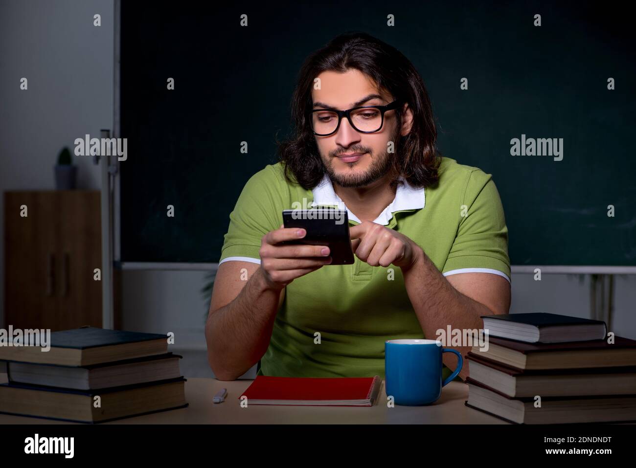Male student working hard at night time Stock Photo - Alamy