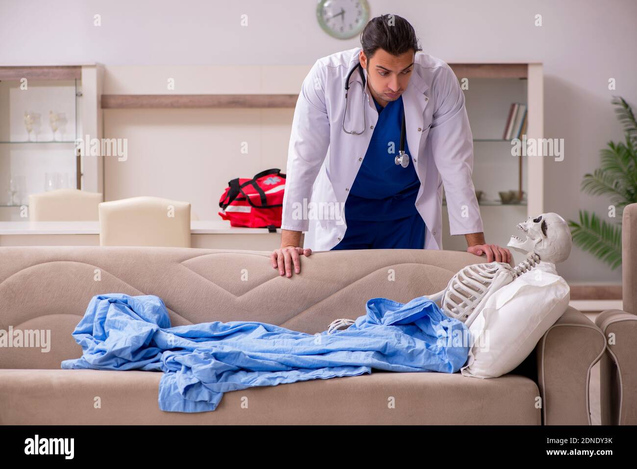 Male paramedic visiting skeleton patient Stock Photo - Alamy