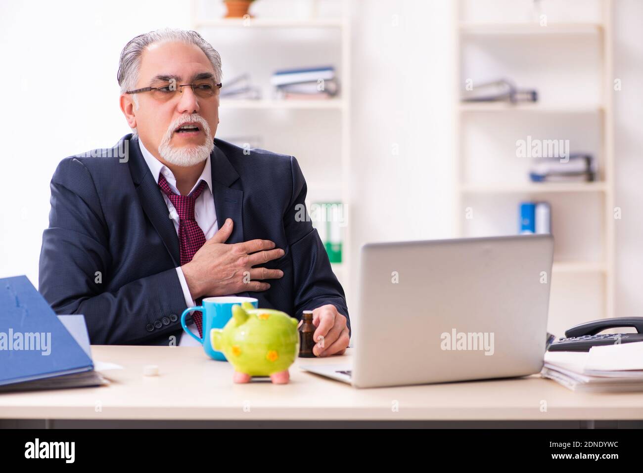 Old businessman in bankruptcy concept Stock Photo - Alamy