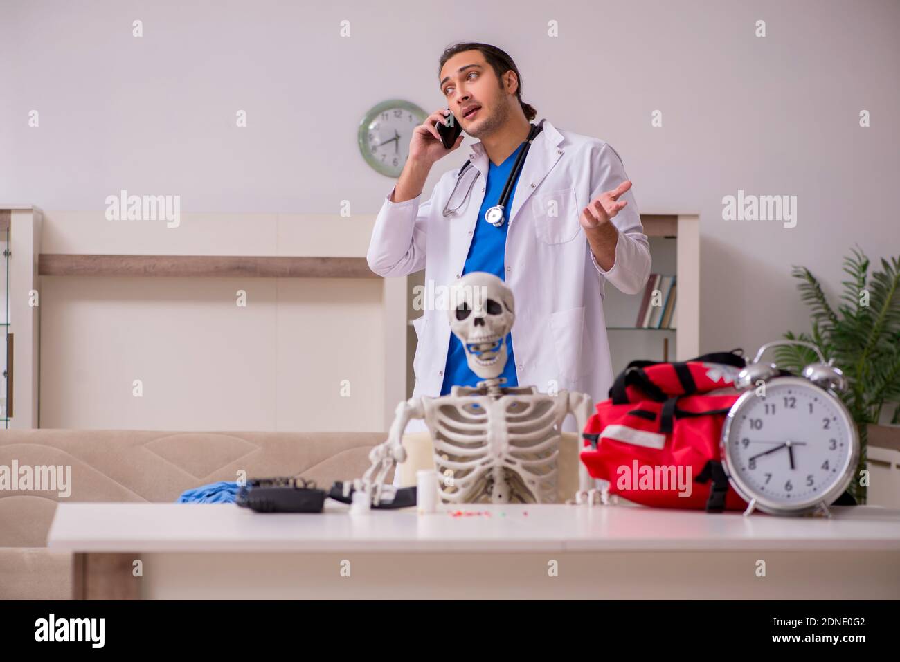 Male paramedic visiting skeleton patient Stock Photo - Alamy