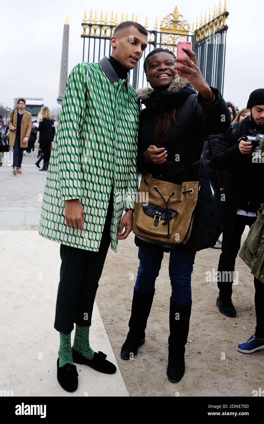 Stromae doing a selfie when arrives to the Valentino Fall/Winter 2015/ ...