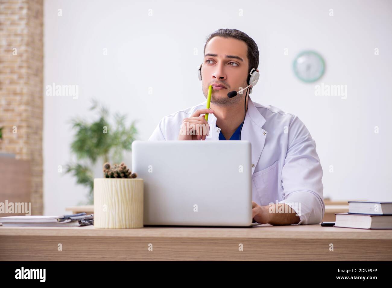 Male doctor in telemedicine concept Stock Photo - Alamy