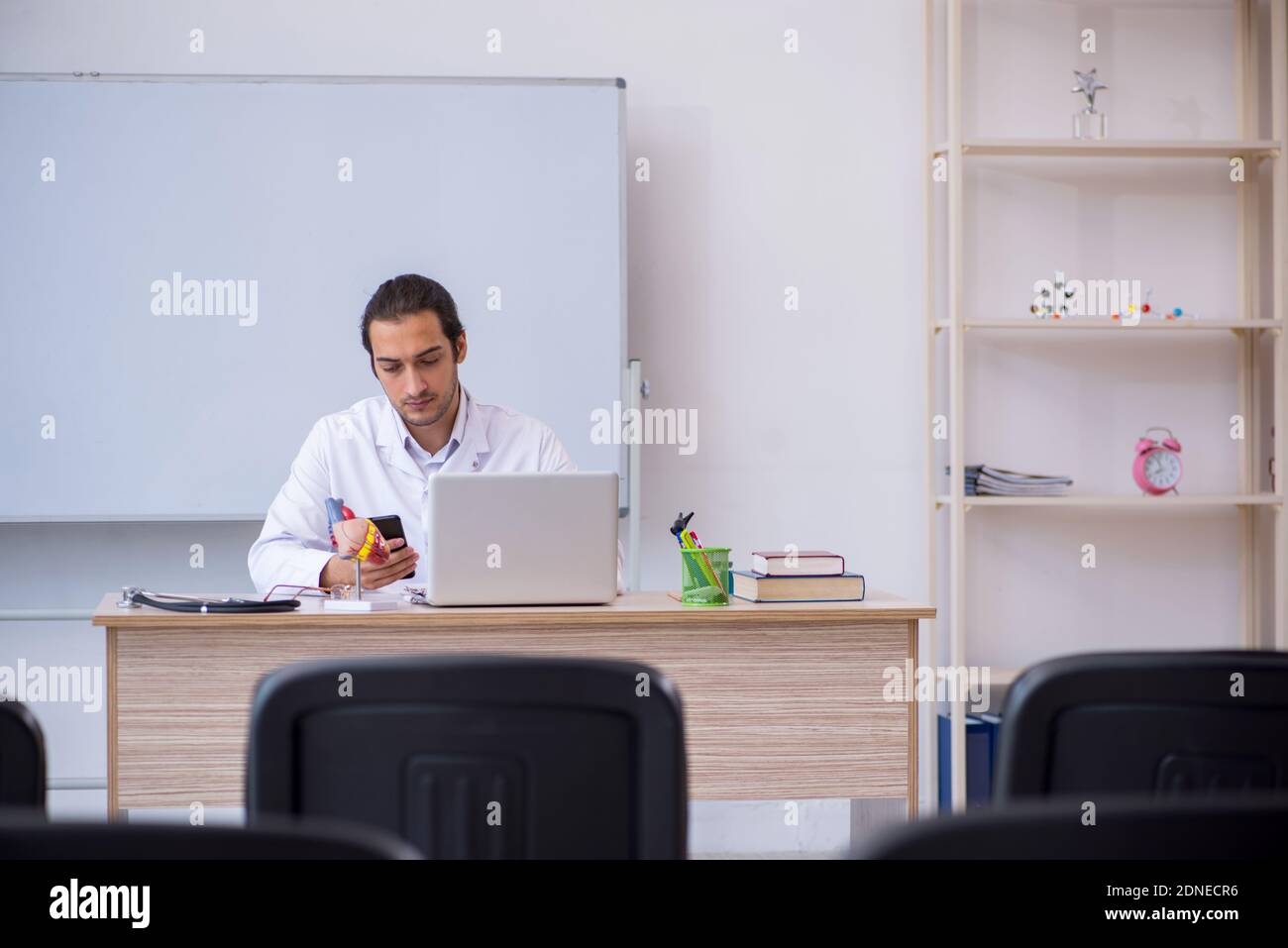 Young doctor giving seminar in the classroom Stock Photo - Alamy
