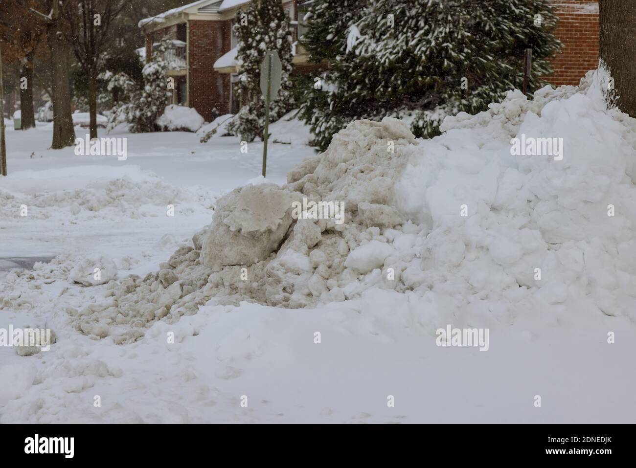 Large snow drift white snow pile lumps on road Stock Photo - Alamy