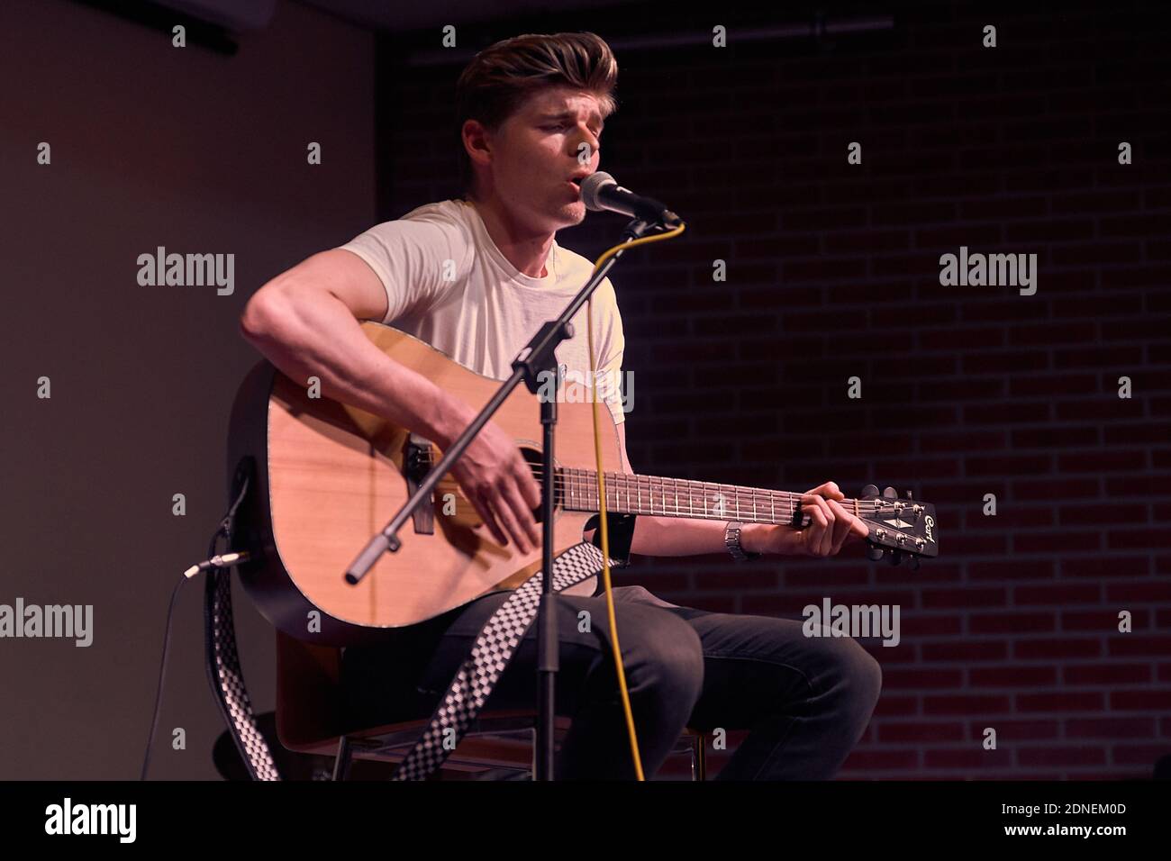 Teenage Boy Playing Guitar At Music Concert Stock Photo - Alamy