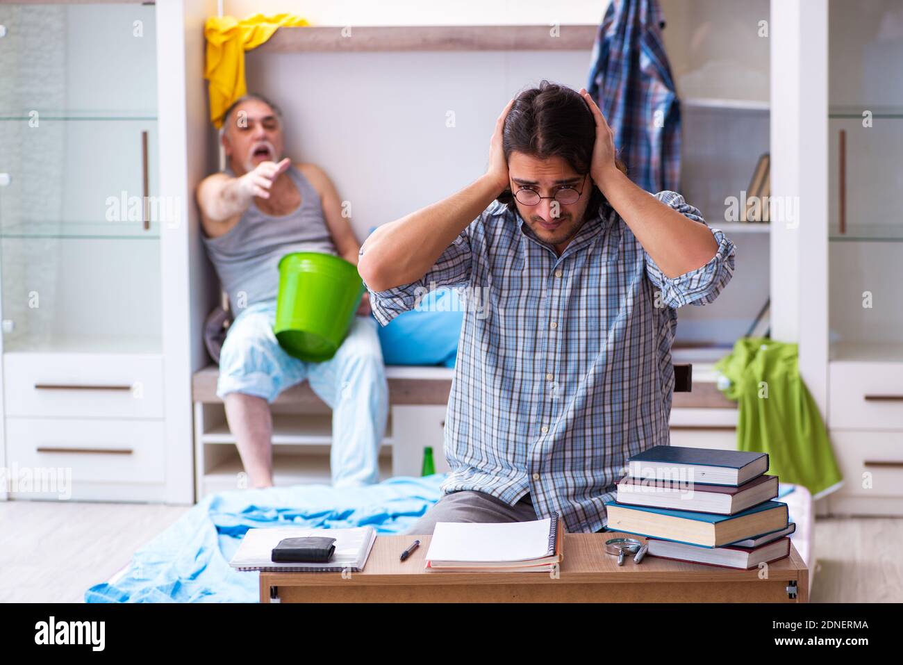 Young son student and dad alcoholic at home Stock Photo - Alamy