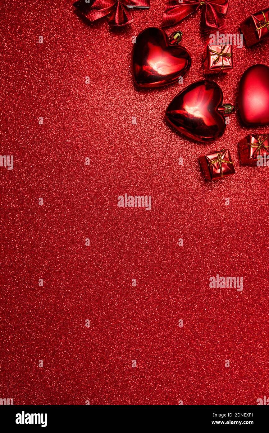 valentines day background, red hearts and gifts on red shiny background ...