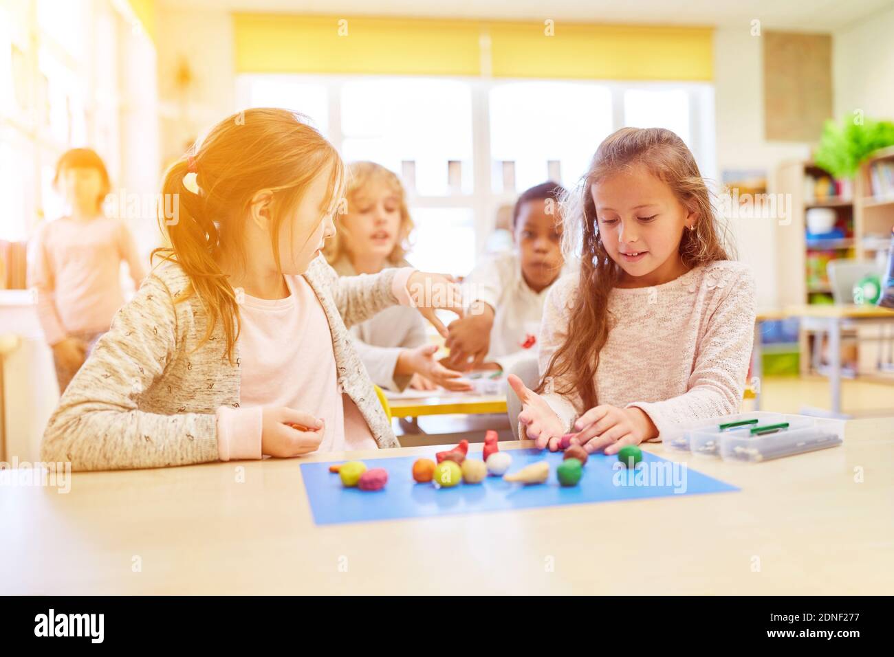 Pre school children playing table hi-res stock photography and images ...