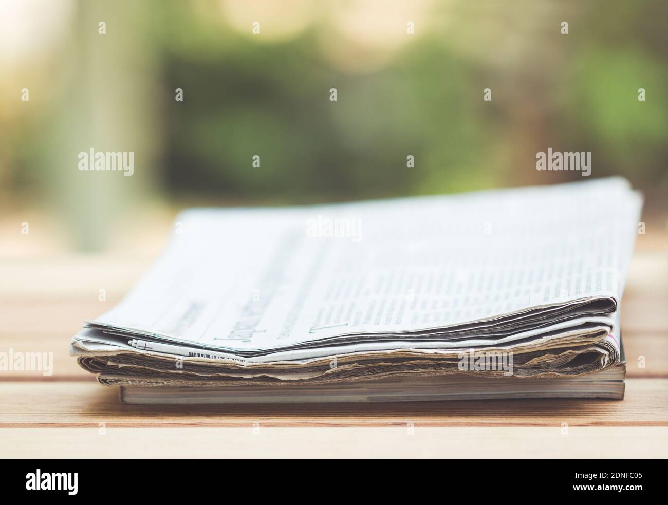 Open newspaper on table hi-res stock photography and images - Alamy