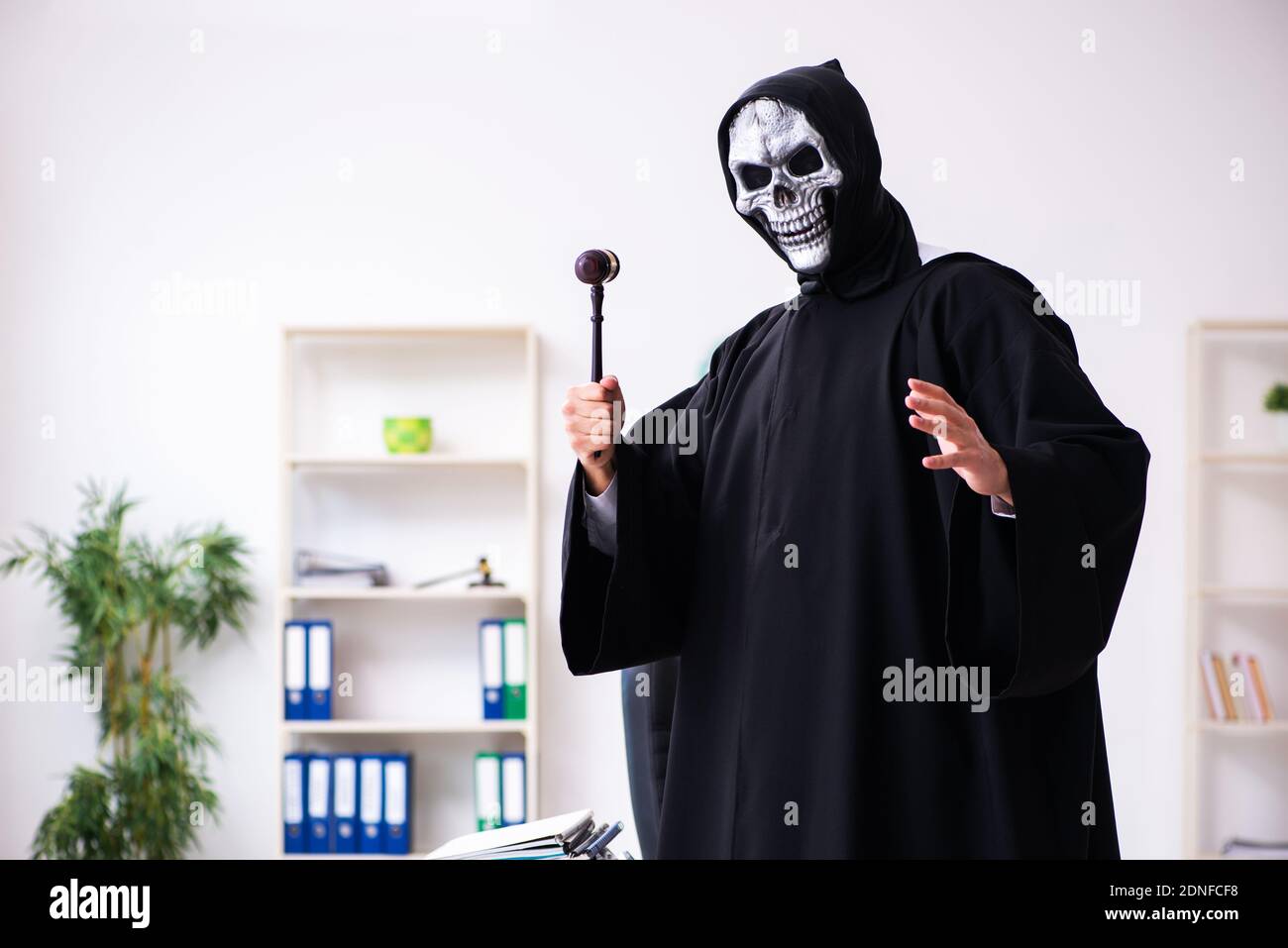 Devil judge working in the courthouse Stock Photo - Alamy