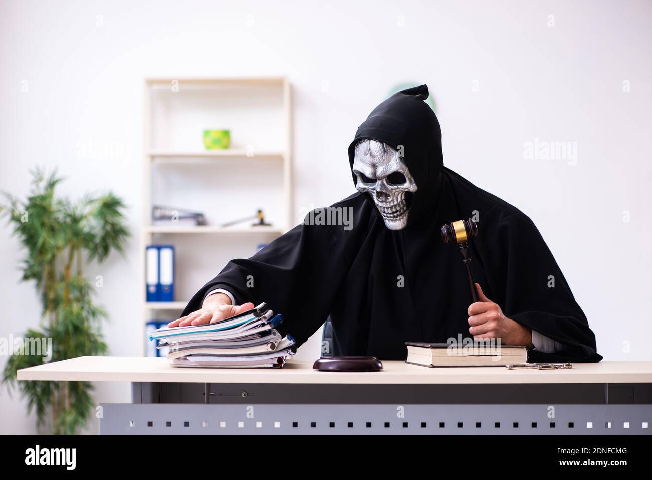 Devil judge working in the courthouse Stock Photo - Alamy