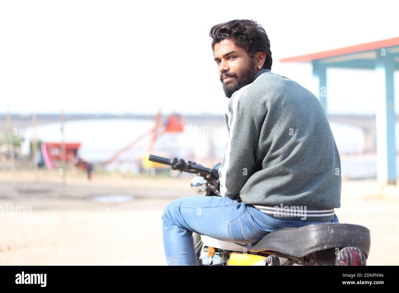 Man sitting on motorcycle at beach hi-res stock photography and images ...