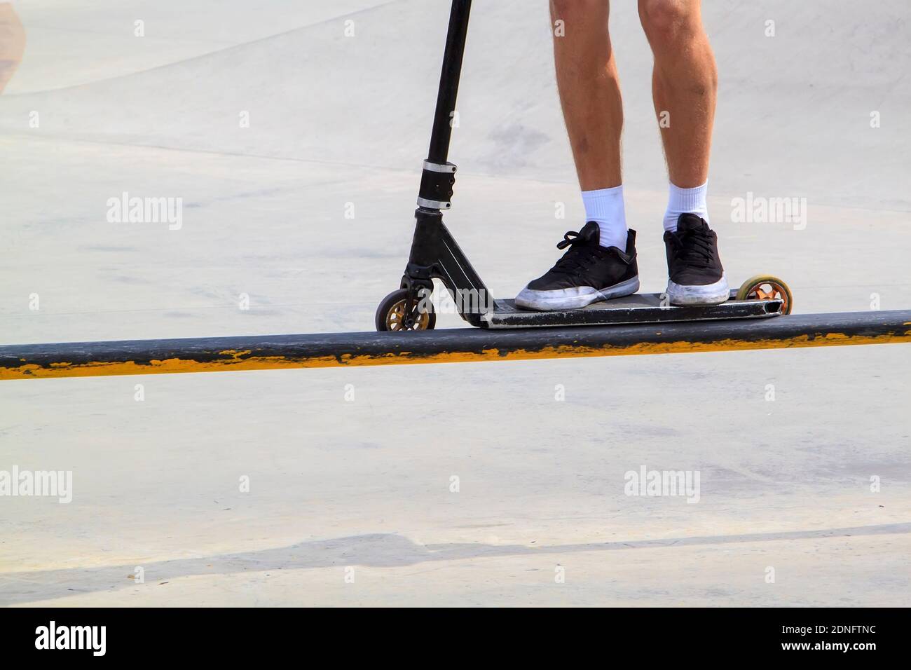 Adult riding scooter on pavement hi-res stock photography and images ...