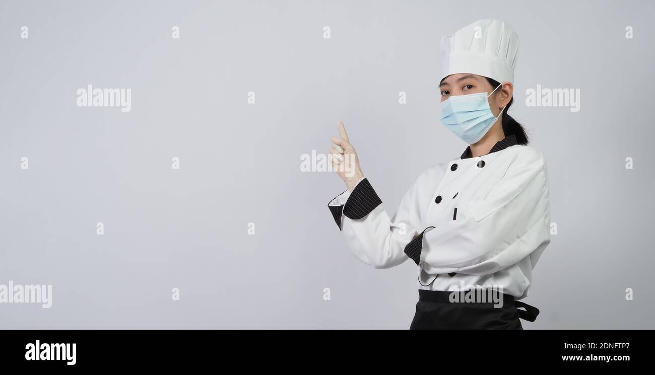 Portrait Of Chef Wearing Flu Mask Standing Against White Background ...