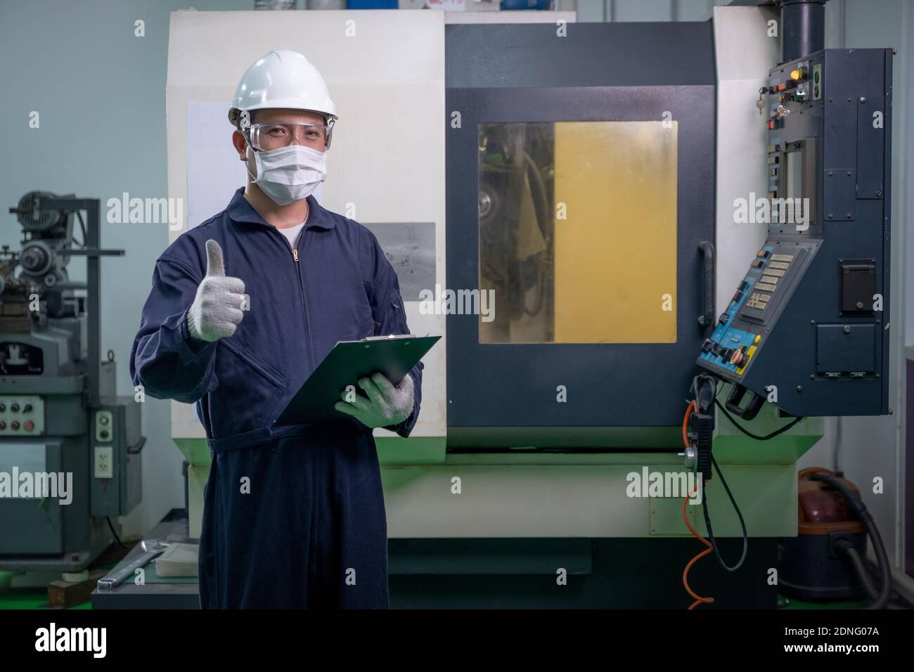 Indian construction worker wearing mask hi-res stock photography and ...
