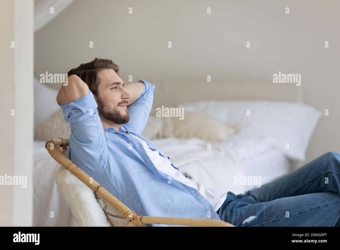 Relaxed man sitting on armchair hi-res stock photography and images - Alamy