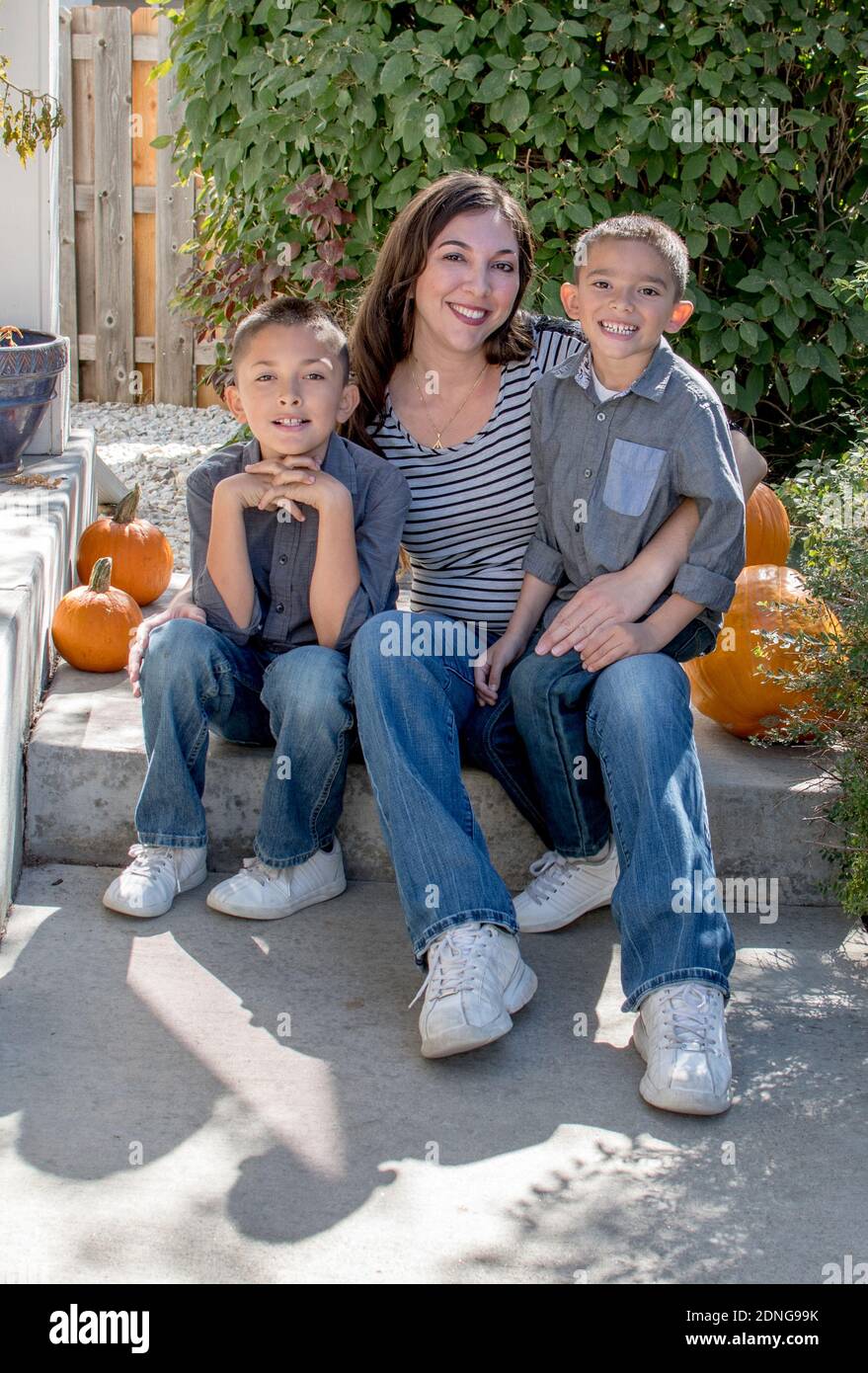 Two boys in autumn garden hi-res stock photography and images - Alamy