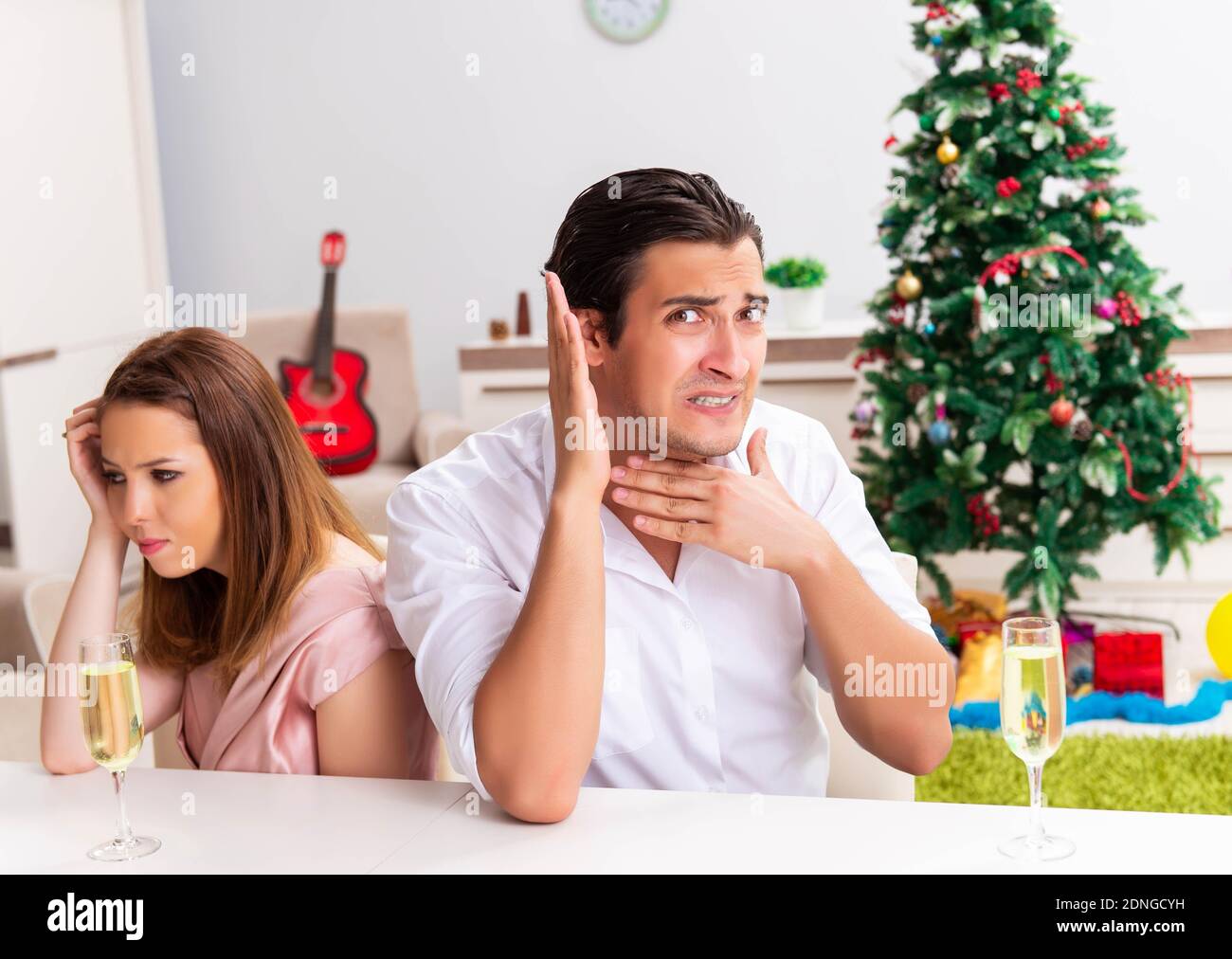 The young pair conflicting at christmas night Stock Photo - Alamy