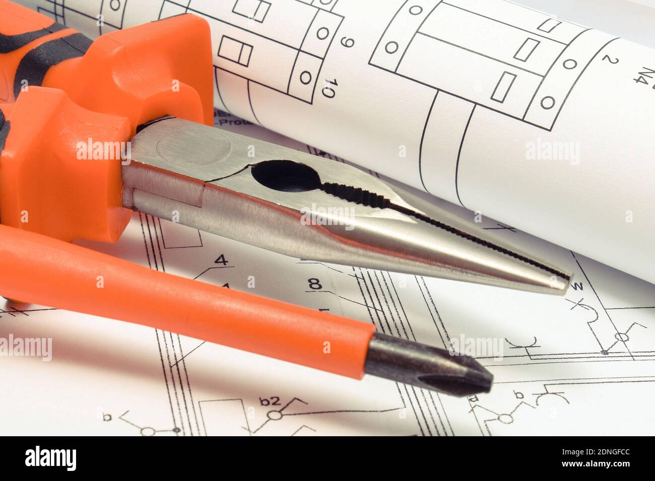 Electrical diagrams and work tools on construction drawing of house ...